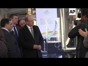 President Putin meets Prince Albert, hands him Olympic torch