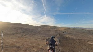 High speed drone chase on a dirt bike rider going off a jump