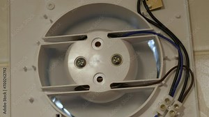 close-up installation and testing of the exhaust fan. installing an exhaust fan in the bathroom in the vent. combating humidity in the bathroom Stock Video