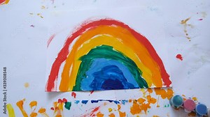 young diverse children paint colorful space pictures together on paper using paint brushes happy kids enjoying fun creativity painting science fiction space drawing pictures top view