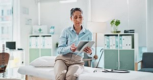 Tablet, doctor and woman in hospital for research, telehealth and check email online on break. Technology, medical and physiotherapist on internet in clinic for info, results and healthcare update