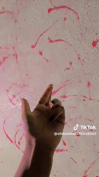 Exploring Red Paint Splatters: A Close-Up Perspective