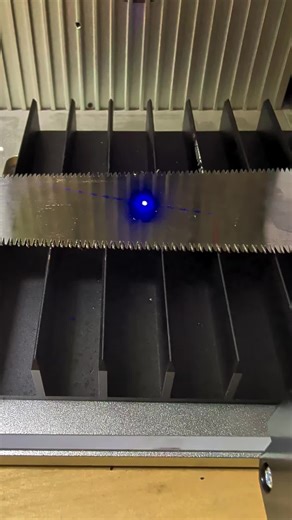Cameras hate lasers. The result doesn't. Custom laser engraving on a Japanese wood saw. #laserengraving #customengraving #makersoftiktok #smallbusiness #woodworking