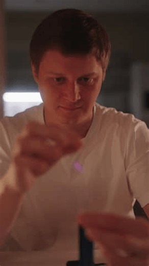 clip-3987908037-vertical-portrait-man-holding-glowing-led-bulbs