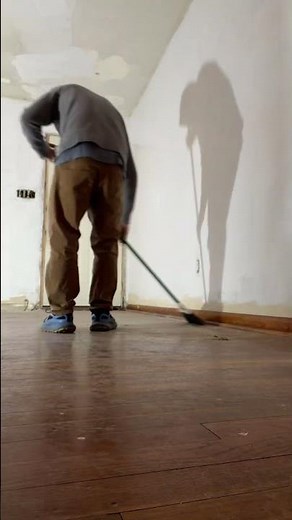 Sweeping the dust that came from smoothing the walls down for paint (with a scraper and sand paper)