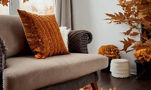 cozy inviting scene featuring modern chair pillows blanket surrounded autumn decor dry leaves evoking warmth comfort fall season new year 2025 celebration graphic