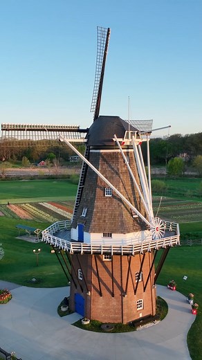 De Zwaan, the historic working Dutch windmill at Windmill Island Gardens, is a stunning sight in the spring. Surrounded by the season's vibrant colors, it's a true testament to Holland's Dutch heritage. 🌷 | Discover Holland