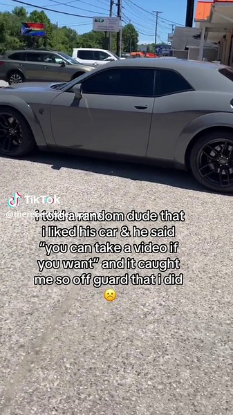 Caught Off Guard: Awkward Encounter with a Car Enthusiast