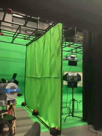 Green Screen Studio Setup with Lighting Rig and Control Monitors