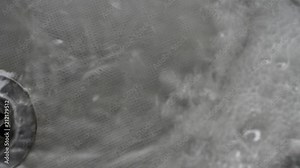 powerfull water stream going to sink drain, pan camera movement