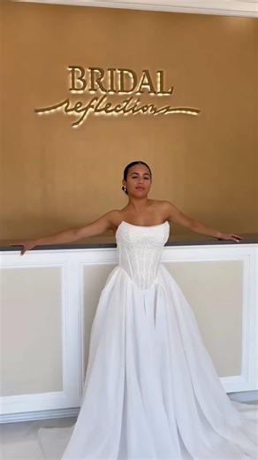 A fairytale, reimagined in French organza. Meet Seraphine by @millanova, a luminous princess gown crafted for the bride who craves romance with a couture edge. Its sculpted drop-waist corset features intricate lacework and optional pearl embellishments, flowing effortlessly into a gathered organza skirt that moves like light and ends in a regal, sweeping train. Seraphine has officially arrived at our Long Island salon and is available to try on with special pricing offered at our trunk show Dece