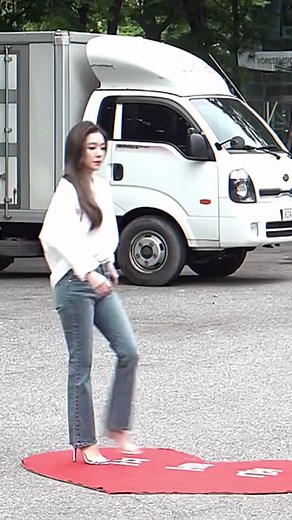 Stylish Women Showcase Confidence on a Red Mat