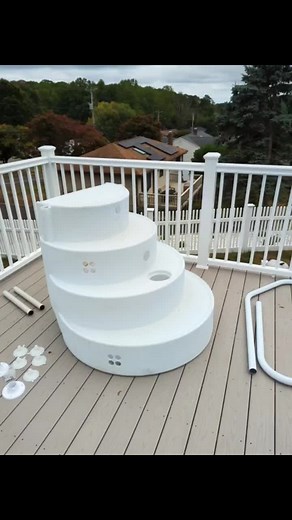 #Tutorial on installing wedding cake style stairs in an #abovegroundpool *NOTE* If your deck is built too high above your pool, you may need to trim the deck side of the rails. #fyp #diy