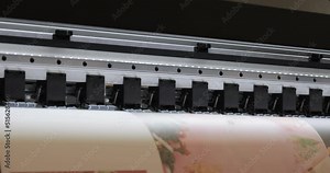 Modern Digital Large format UV printer. Printing production technologies. UV pinning is the process of applying a dose of low intensity ultraviolet light to a UV curable ink