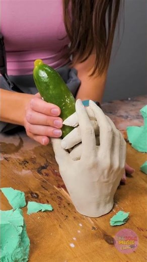 She made a hand mold… but why is there a cucumber? 🥒🖐️
