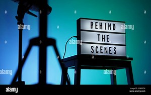 Cinema Light box. Behind the scenes letterboard text on Lightbox. Multi color LED on background. Sillhouette flash snoot hood on tripod. video product Stock Photo - Alamy