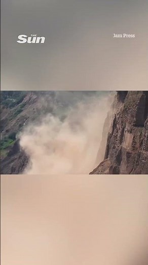 Terrifying moment cliff COLLAPSES yards away from sunbathing beachgoers