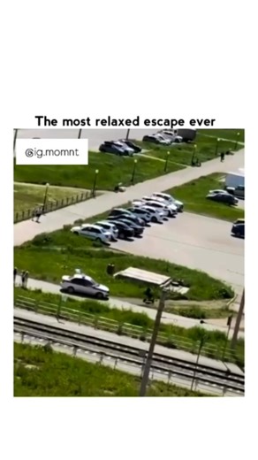 IG MOMNT | The post features a 50-second viral clip captioned "The most relaxed escape ever," capturing a surreal, low-speed pursuit filmed from a... | Instagram