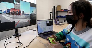 Lily Shaw drives her Coco delivery bot in Santa Monica