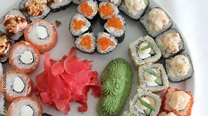 Sushi roll set on white plate background. Sushi japanese food in restaurant. Japan restaurant menu top view