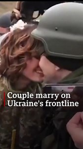 A Ukrainian couple got married in a military-style wedding at a check point near Kyiv. https://bit.ly/3sPl6Ga | BBC News