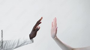 Multiethnic friendship. Global unity. Boomerang animation. Diversity relationship. African man Caucasian woman high five hand gesture gif loop isolated on white free space.