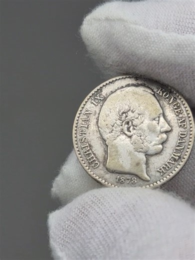 1878 10 Cents Danish West Indies Coin Christian IX Obverse: Bust Christian IX facing right Obverse legend: CHRISTIAN IX KONGE AF DANMARK 1878 Reverse: Sugar cane. Denomination Reverse legend: DANSK VESTINDISK MØNT. 10 CENTS Edge: Reeded Denomination: 10 Cents Country: Danish West Indies (1730-1917) Ruler: Christian IX (1863-1906) Year: 1878 Mintage: 80 000 Mint: Copenhagen, Denmark Metal: Silver (.625) Weight ±: 3.41 g. Diameter ±: 21 mm Authenticity unconditionally guaranteed!