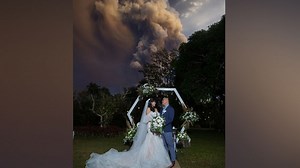 Wedding in the Philippines continues despite volcano eruption
