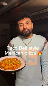 Taco Bell style Mexican Pizza 🔥 Recipe below ⬇️ Ingredients • 1 cup whole pinto beans (boiled) • ½ cup hot water • 1–2 tbsp taco seasoning • 2 store-bought soft tortillas • ¼ cup taco sauce • ¼ cup enchilada sauce • ½ cup shredded cheese • ½ tomato, chopped • 2–3 spring onions, chopped • Optional toppings: olives, jalapenos, green peppers, onion • Taco sauce or sour cream for serving • Oil for frying tortillas Method: 1. Prepare beans: Boil pinto beans in pressure cooker. Mash in a pan with hot