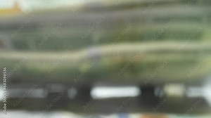 Close up of currency counting machine counting dollar bills. Banknote counter. Money counter with dollar bills. Money counter machine is counting American hundred dollars banknotes.