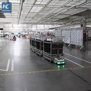 Small & smart! Automated vehicles are employed to transport giant components at a car plant in Tianjin, China | China Xinhua Sci-Tech
