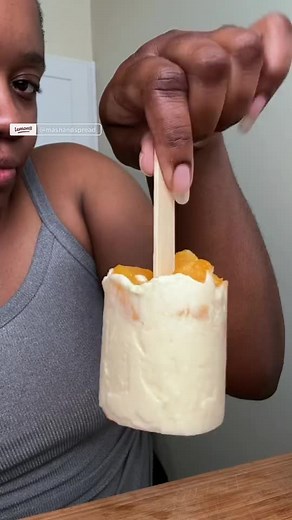 Trader Joe’s Frozen Yogurt Popsicles🍑🥭. So easy you don’t even need a popsicle mold. Grab these yogurt cups and make these this summer! Here’s what you’ll need: - 1 (6 pack) Trader Joe’s Peaches & Cream, Mango & Cream Yogurt Cups - Fresh fruit, diced ( I used 1 mango and 1 peach) - 6 Popsicle sticks Instructions: 1. Add diced fruit to each yogurt cup and mix with a spoon. 2. Place a popsicle stick in the middle (stopping midway). 3. Transfer to the freezer for 4 hours or you until set. 4. When
