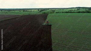 Agriculture. Tractor work on green field. Aerial survey of farm. Farmer in wheat field Tractor work on farm. Landscape of field. Agriculture concept. Farmer work with green wheat. Aerial wheat field