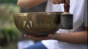 Experience profound tranquility and deep healing through the soothing practice of sound therapy using a singing bowl