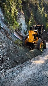 What Did the Deere Grader Do to the Large Rock on the Cliff Edge_ #grader #motorgrader | 1001 Ideas