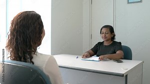 Smart and confident woman hiring manager or recruiter conducting interview with a job applicant in the office