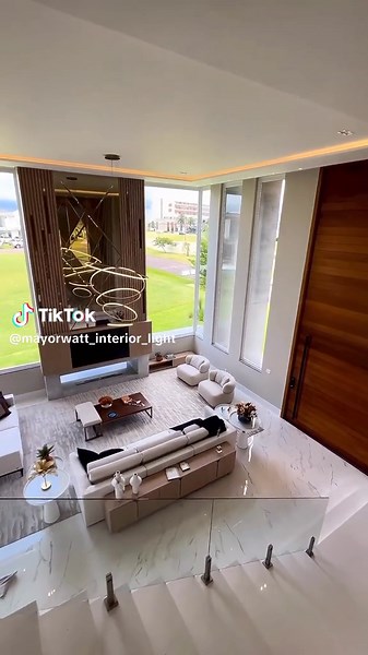 So this is what a dream home looks like? 😍😍 A spectacular mansion with open concept living room, double straight foot, wide windows, plenty of natural light, central chandelier and tasteful decor! Perfect Amazing living room interior design concepts, giving a beautiful view of sunset. #luxuryliving #livingroom