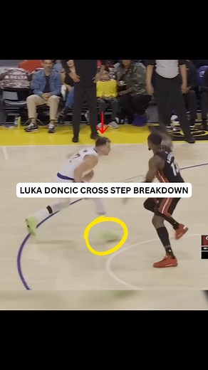 Luka has the ball at the top of the key and forces the switch on the bigger defender while coming off the ball screen toward his left. As soon as he forces the switch, he stays low and does a slow between-the-legs dribble while floating forward and hanging the ball wide outside his left hip. Once he finishes the move, he quickly does a hang crossover and then swings his right foot across his body. Once his foot crosses his body, he does a quick between-the-legs dribble, attacks downhill toward h
