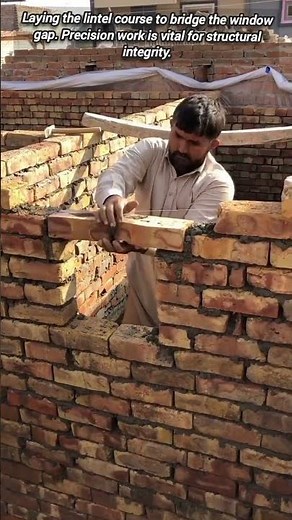 Creating the precise window gap while laying the upper brick course.