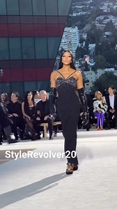 "@Donatella_Versace took her fall 2023 collection to Los Angeles, staging her show this afternoon ahead of the Oscars on Sunday. Models, including @Naomi, @gigihadid, and @riannevanrompaey walked down the runway with the city’s dusking skyline as a backdrop. @Versace grounded her collection in black and camel, using textures—leather, silk, wool suiting—as accents; with pops of coral, fuchsia, and cyan punctuating the lineup. Like the show’s soundtrack, a mix of opera and techno, the designer mer