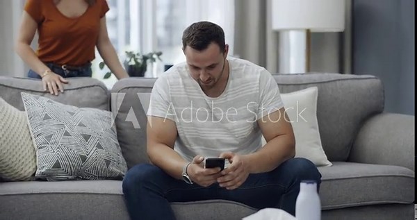 Infidelity, couple and caught internet cheating with fight, conflict or argument about social media. Phone, divorce or breakup with man and woman on sofa in home living room for online communication