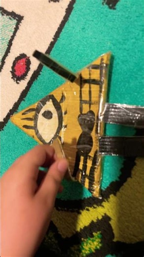 I made a bill cipher figure out of cardboard, tape, and paint and toothpick ￼