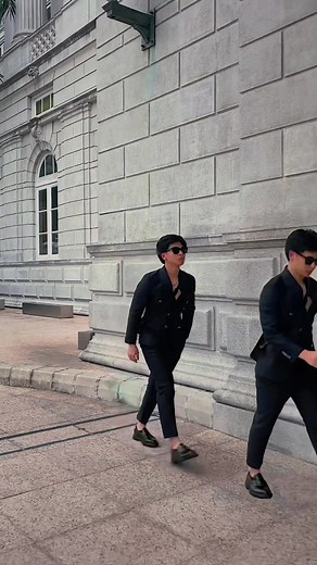 Stylish Black Suits in a Classic Setting