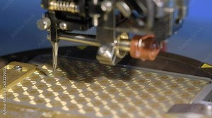 A special modern machine installs a silicon microprocessor on the board. The robot manipulator solders the chip contacts to the matrix. Modern computer technology