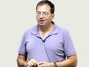 Random Walks on Groups and the Kaimanovich-Vershik Conjecture for Lamplighter Groups