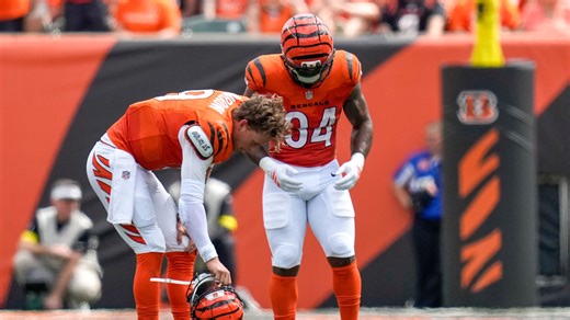 Joe Burrow back with Bengals three days after surgery, with rolling scooter, foot in cast