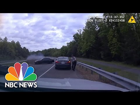 Watch: Car spins out of control crashing into officer making traffic stop