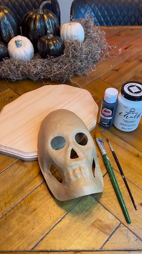 Quick DIY Halloween Skull Plaque 💀 This project was so EASY and QUICK! We have our popular skull mask that I wanted to try and create something for our Halloween decor. What a better way to display the mask glued onto a plaque. This will sure help add to your Halloween displays and add that spooky feel of someone watching you! 💀All is needed is 5 simple crafting materials! How would you create yours? | Factory Direct Craft