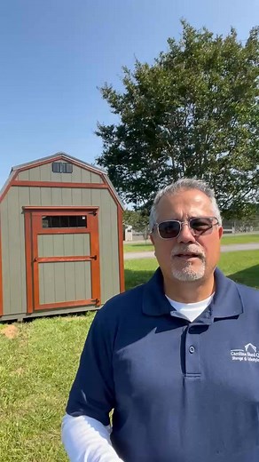 This 8x12 shed features durable LP SmartSide siding in a modern gray finish with bold redwood-stained trim. The barn-style gambrel roof provides extra overhead storage space, while the transom window, black hardware, and gable vent add function and style. Perfect for tool storage, a workshop, or a backyard upgrade. Father’s Day Special – Take 15% Off! Give Dad the space he deserves with this rugged, reliable shed. Hurry—this offer ends June 30th! Don’t miss your chance to save big and make this 