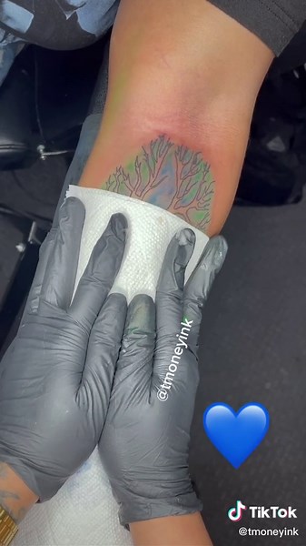 What’s under the blue heart? 🥶For mother and son 💙 #tattoo #blue #elephant #butterfly #foam #reveal